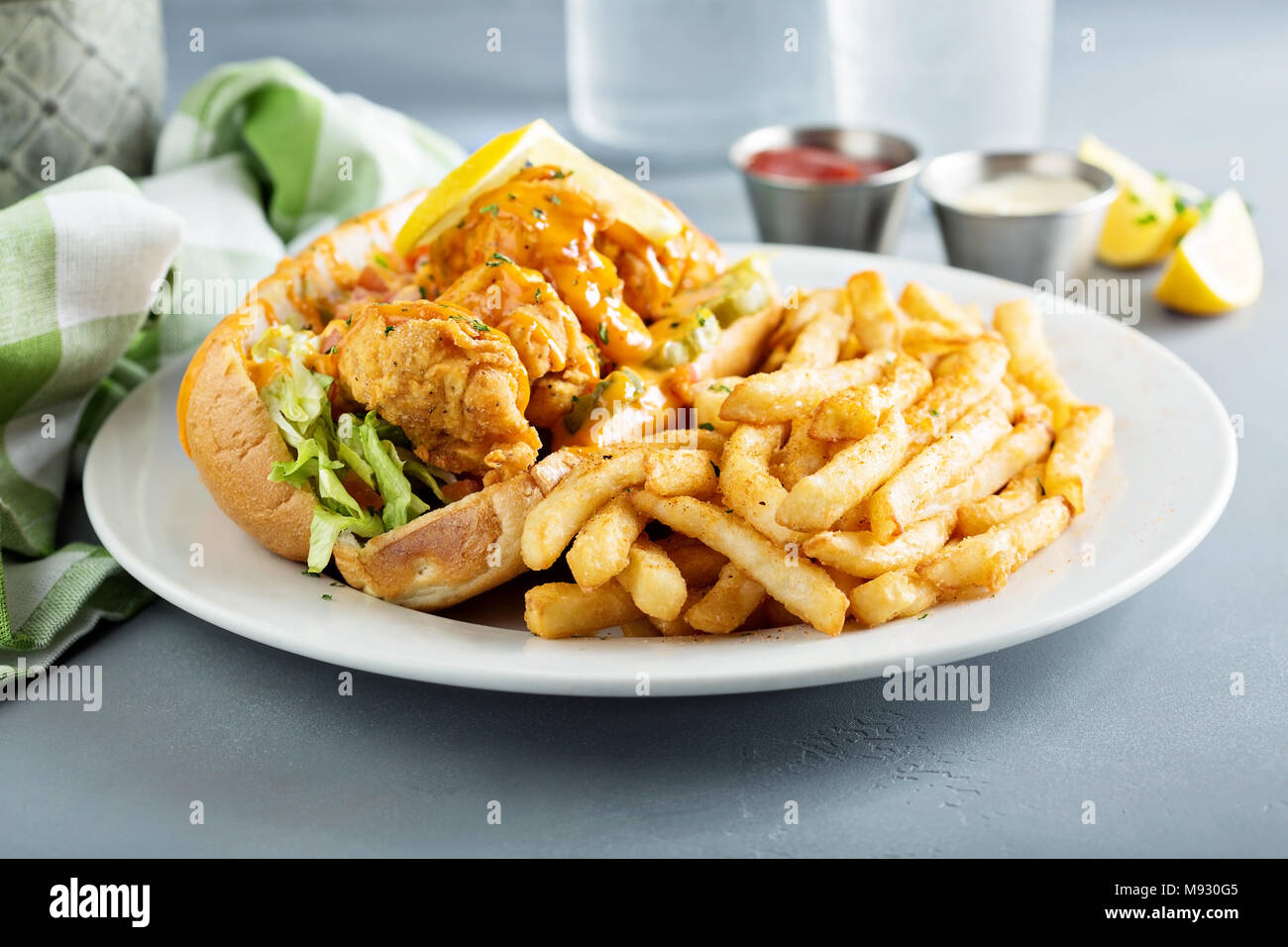 Po boy sandwich with fried shrimp and fries Stock Photo - Alamy