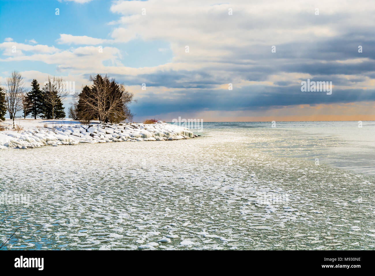 Winter Landscape Scene showing white snow along icy water lake coastal ...