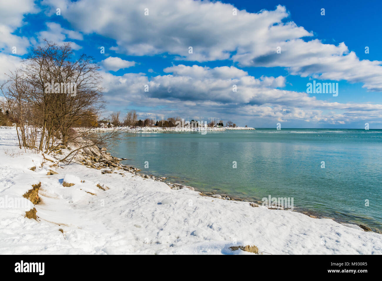 Winter Landscape Scene showing white snow along icy water lake coastal ...