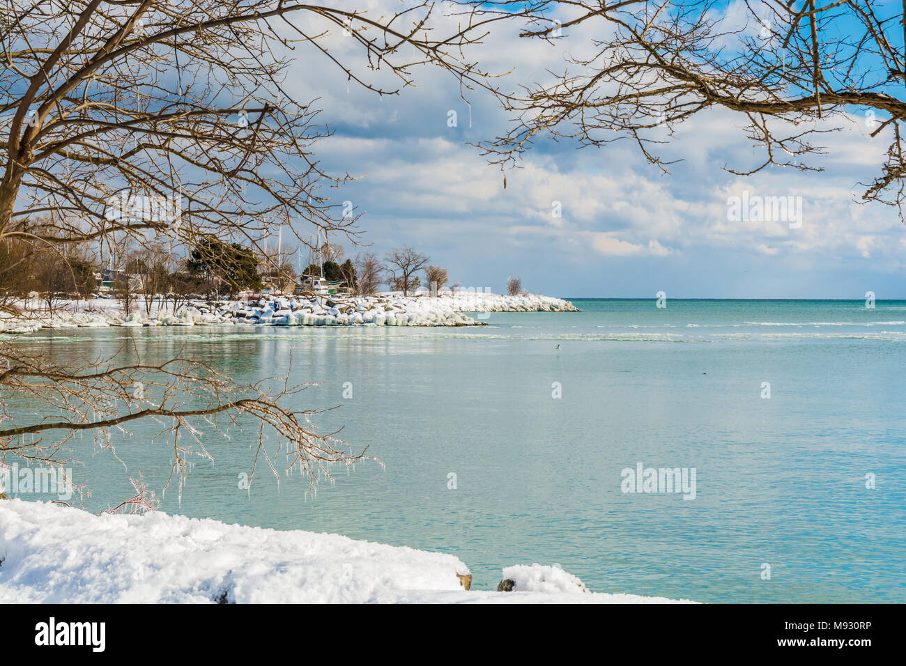 Winter Landscape Scene showing white snow along icy water lake coastal ...