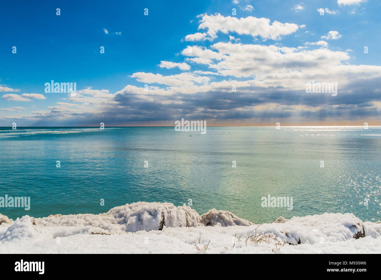 Winter Landscape Scene showing white snow along icy water lake coastal ...