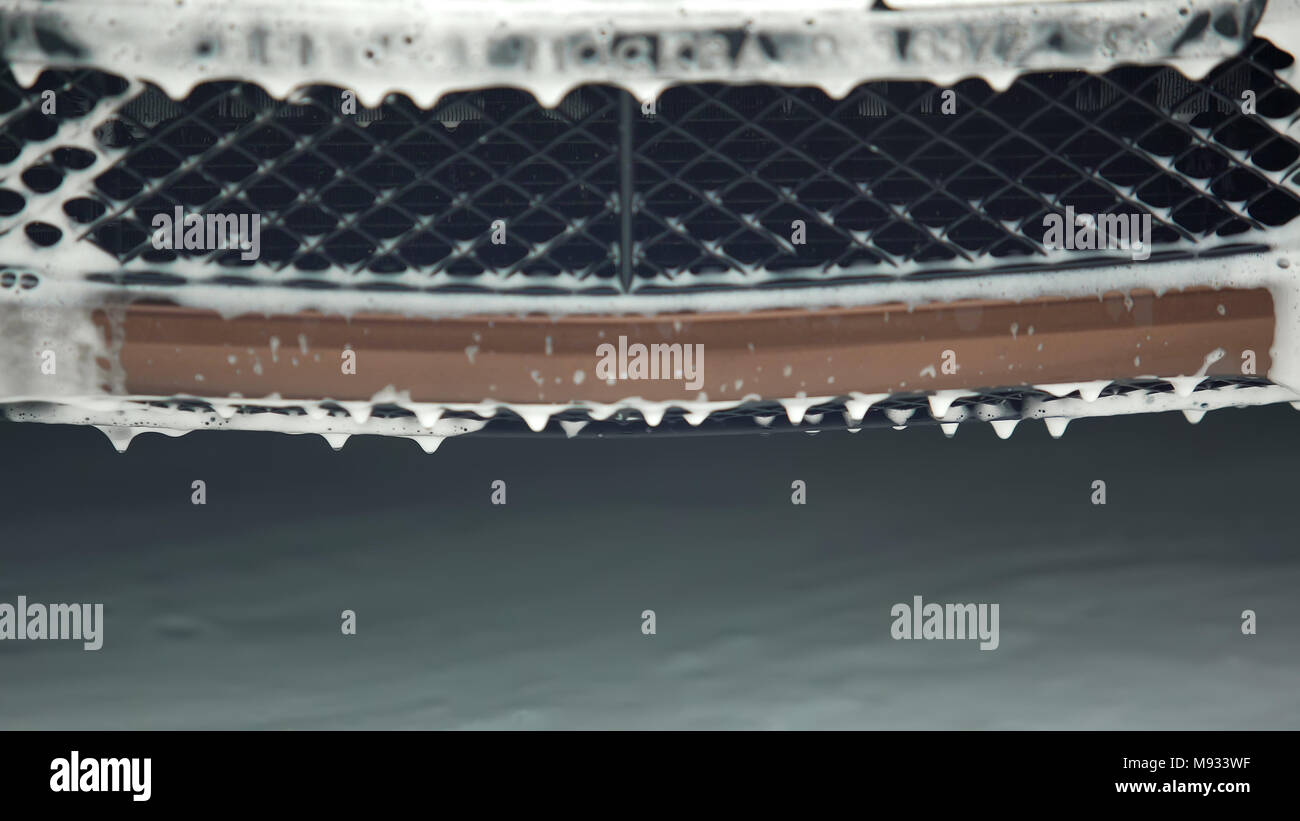 Cleaning foam flowing down the radiator, carwash service, profitable ...
