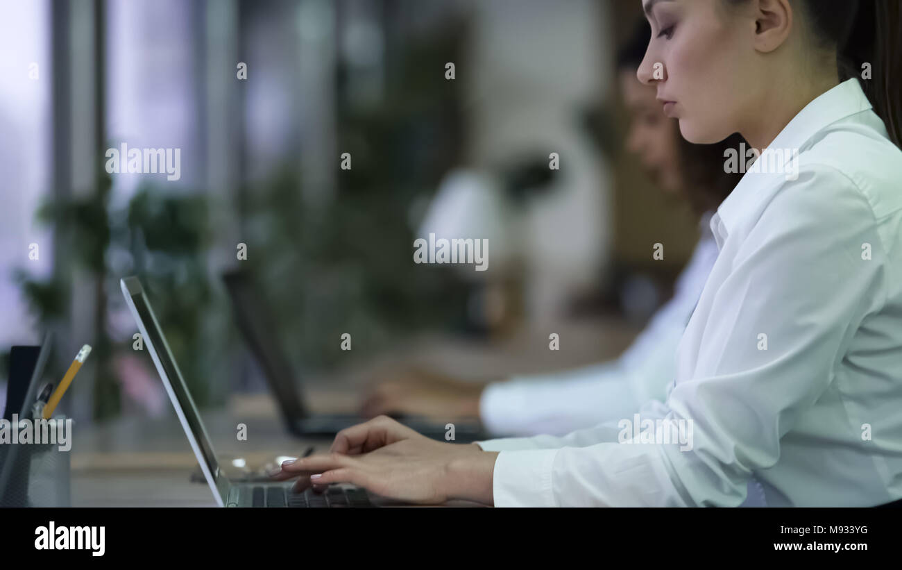 Beautiful woman typing on laptop, working on business project with ...