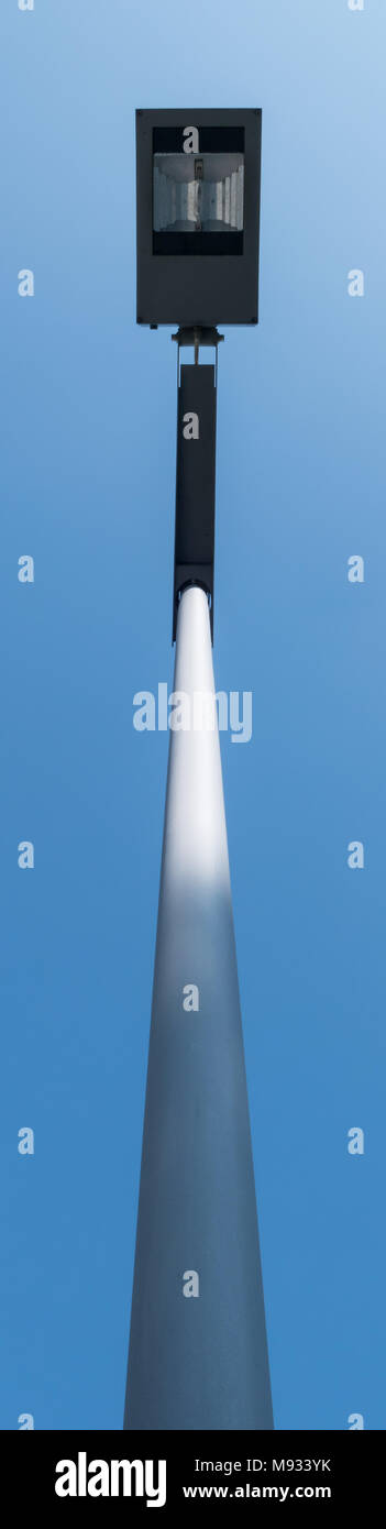 Rectangular and modern street light with blue sky as background. Bottom ...