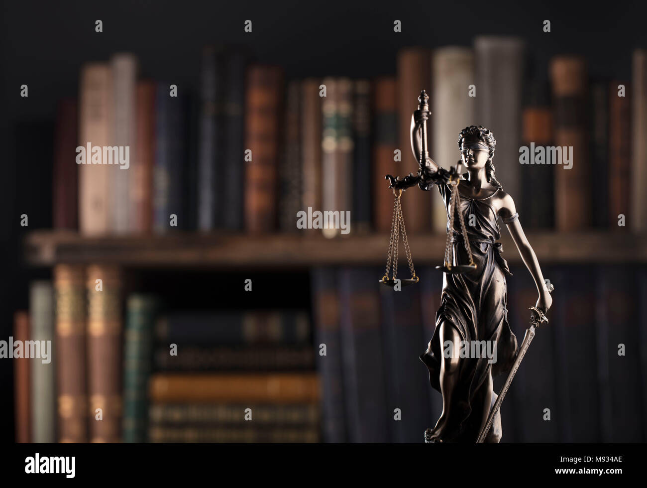 Lady justice on brown background Stock Photo - Alamy