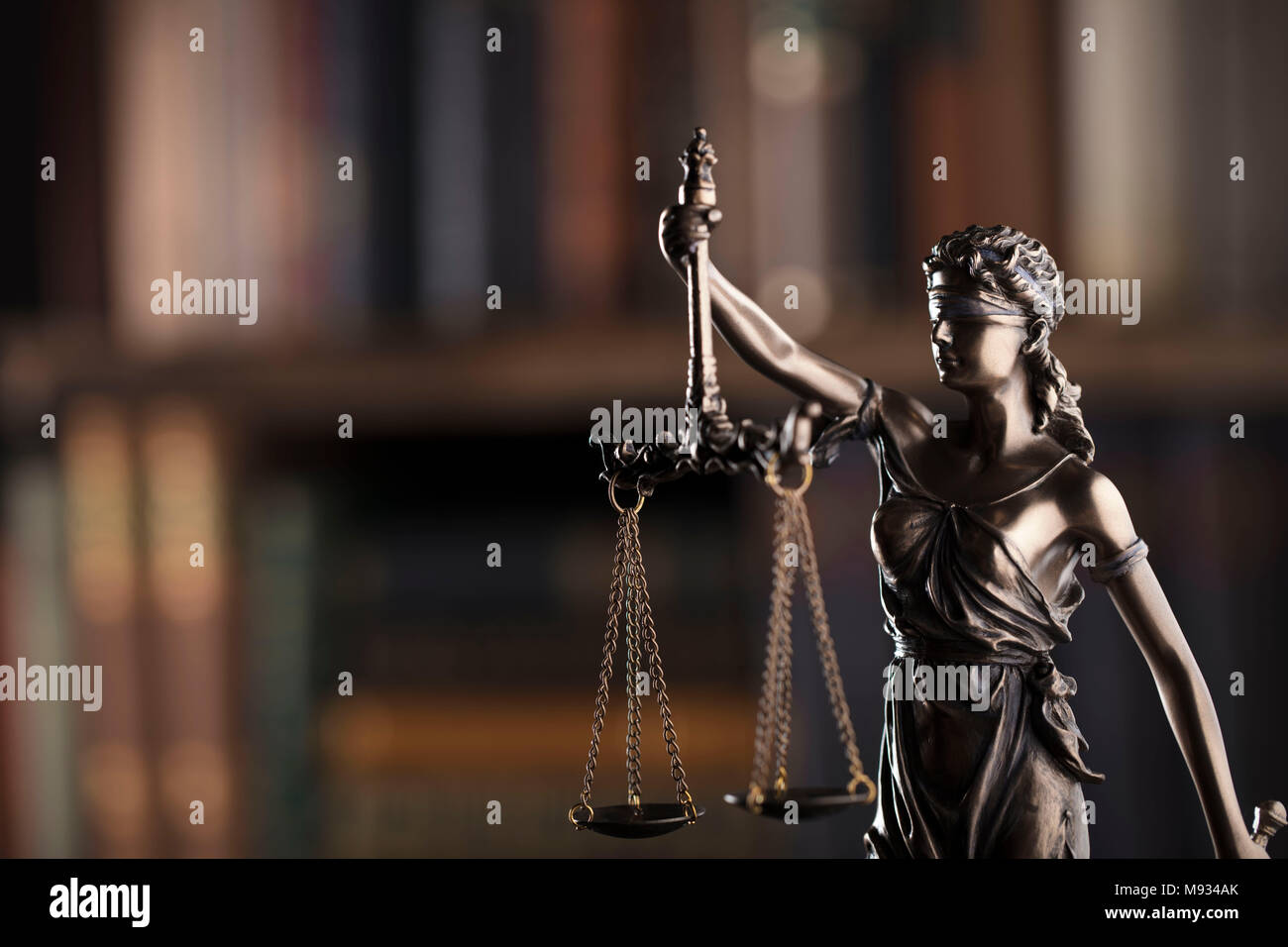 Lady justice on brown background Stock Photo - Alamy
