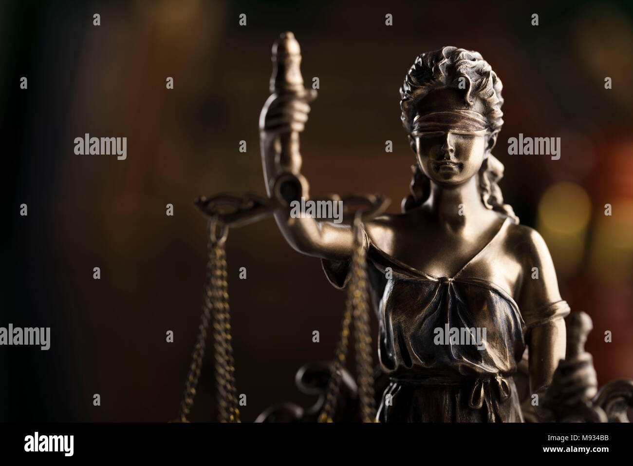 Lady justice on brown background Stock Photo - Alamy
