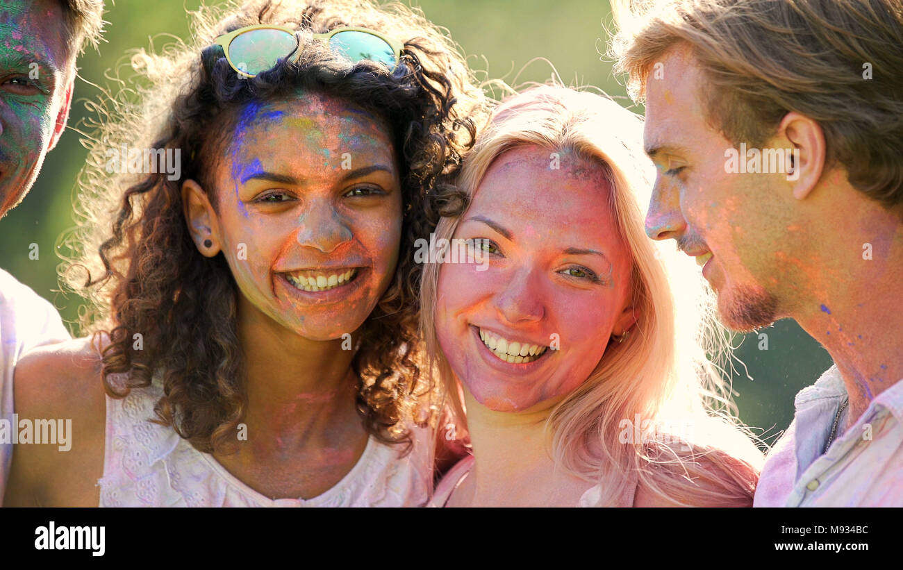 Sincere smiles on faces of cheerful friends laughing and having fun ...