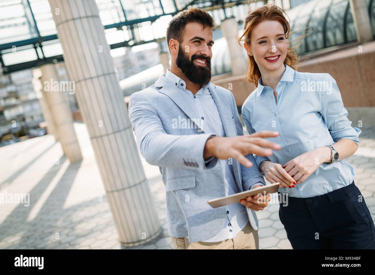 Business people discussing ideas outside Stock Photo - Alamy
