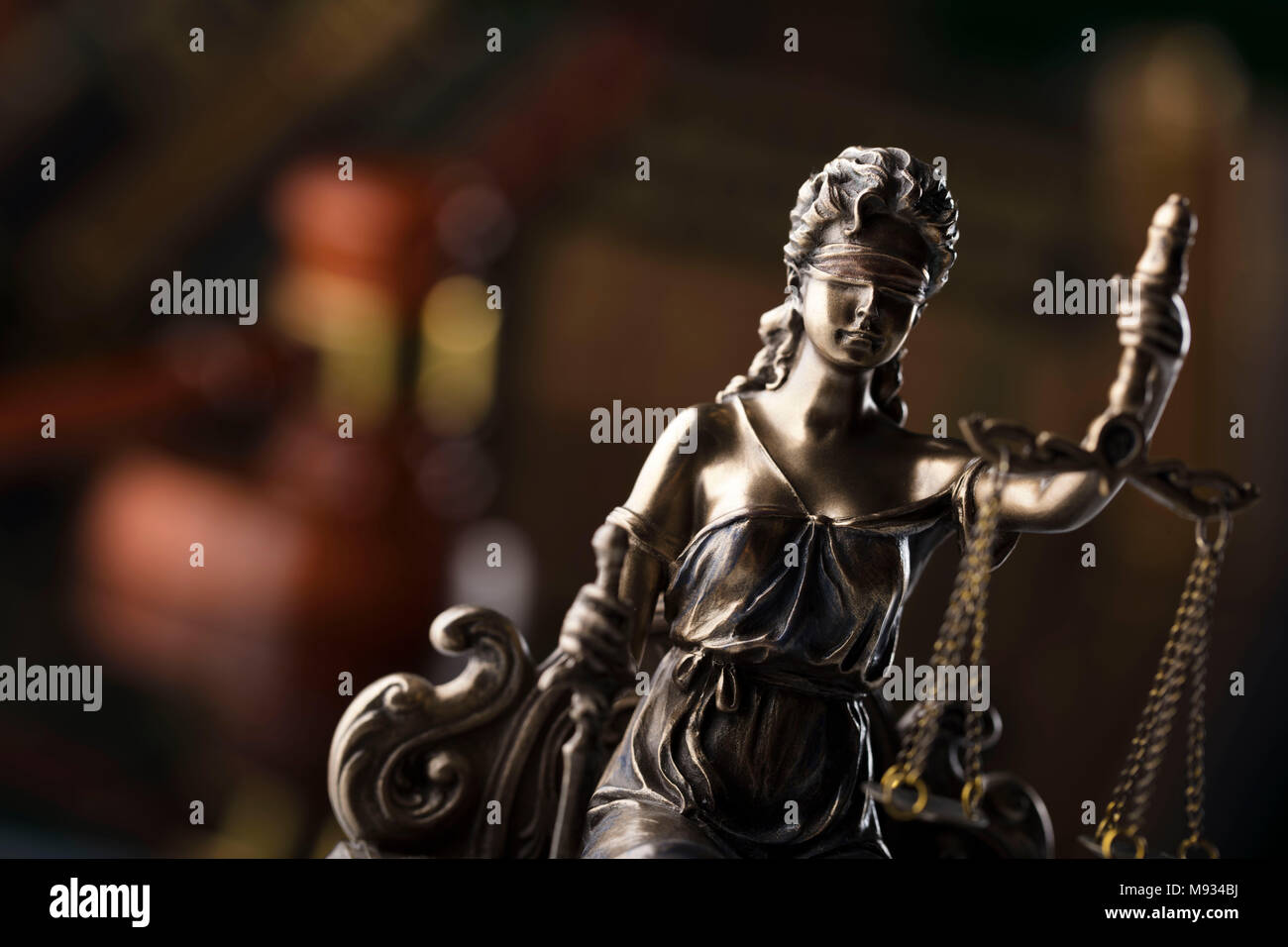 Lady justice on brown background Stock Photo - Alamy