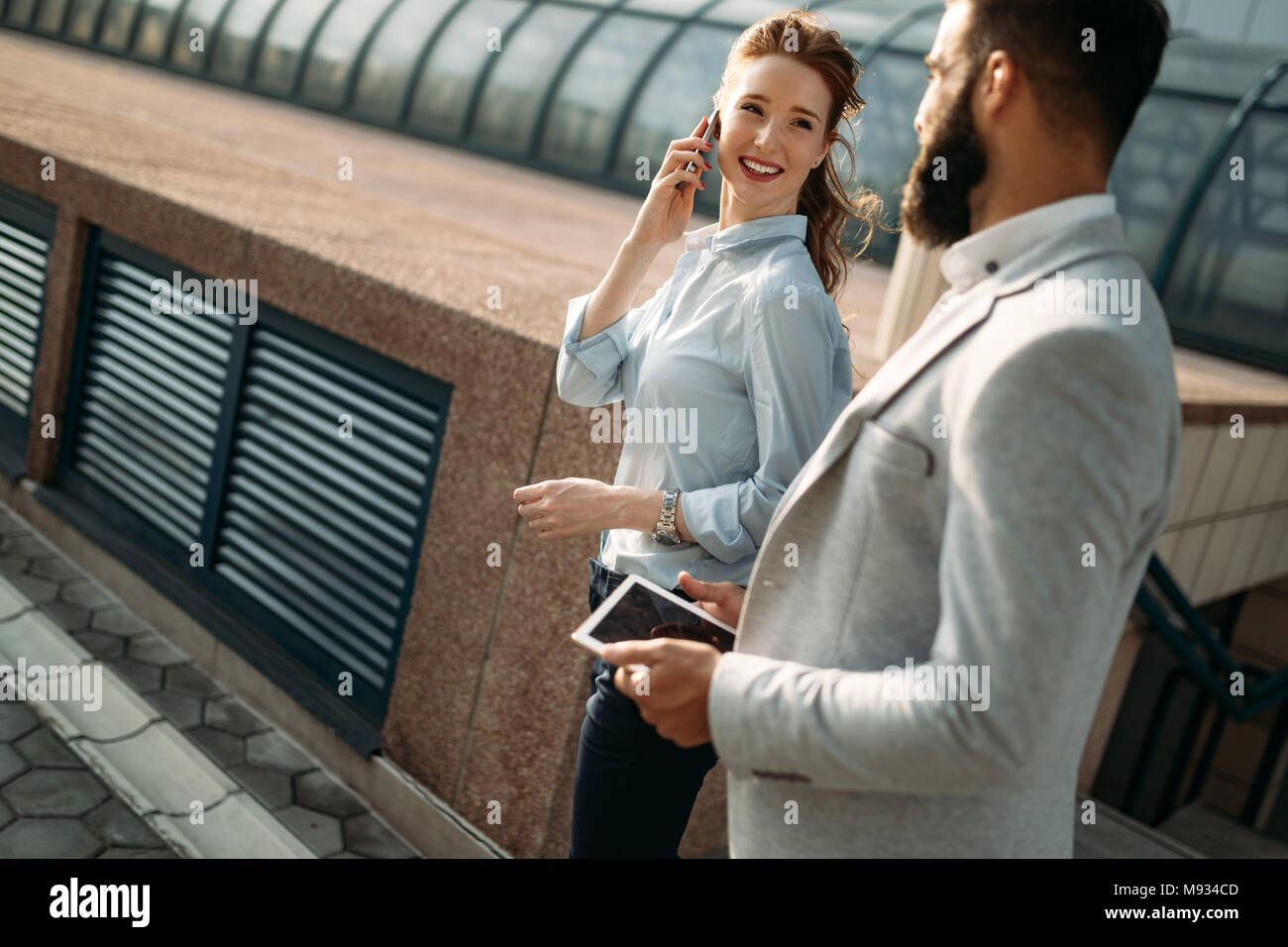 Business people walking and talking outdoor Stock Photo - Alamy
