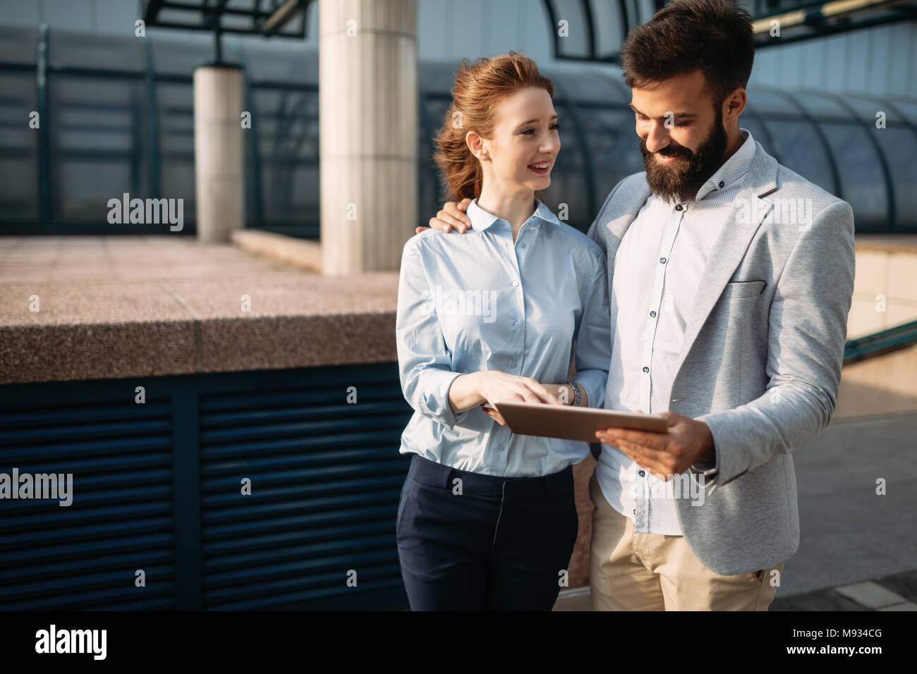 Business people discussing ideas outside Stock Photo - Alamy