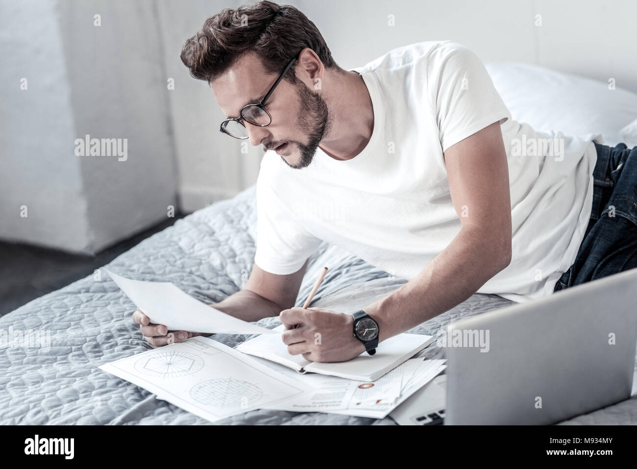 Smart serious man working at home Stock Photo - Alamy