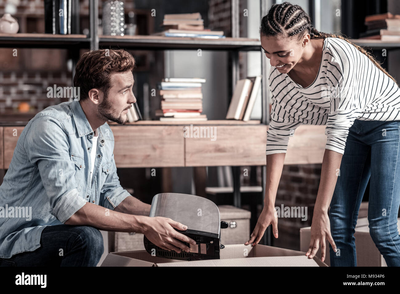 Nice young man holding a toaster Stock Photo - Alamy