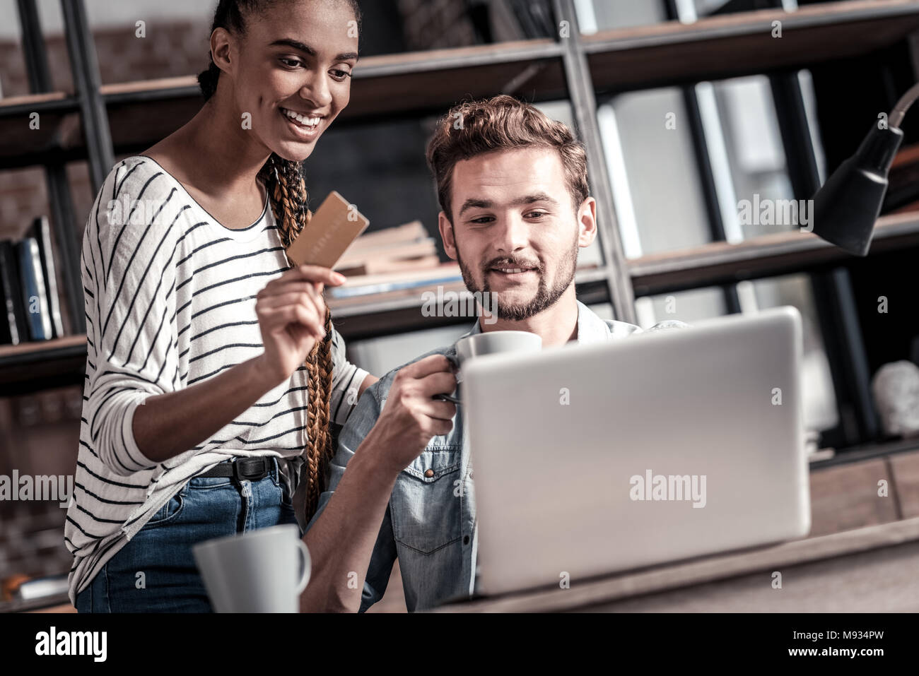 Positive attractive woman using a credit card Stock Photo - Alamy Positive attractive woman using a credit card Stock Photo - Alamy