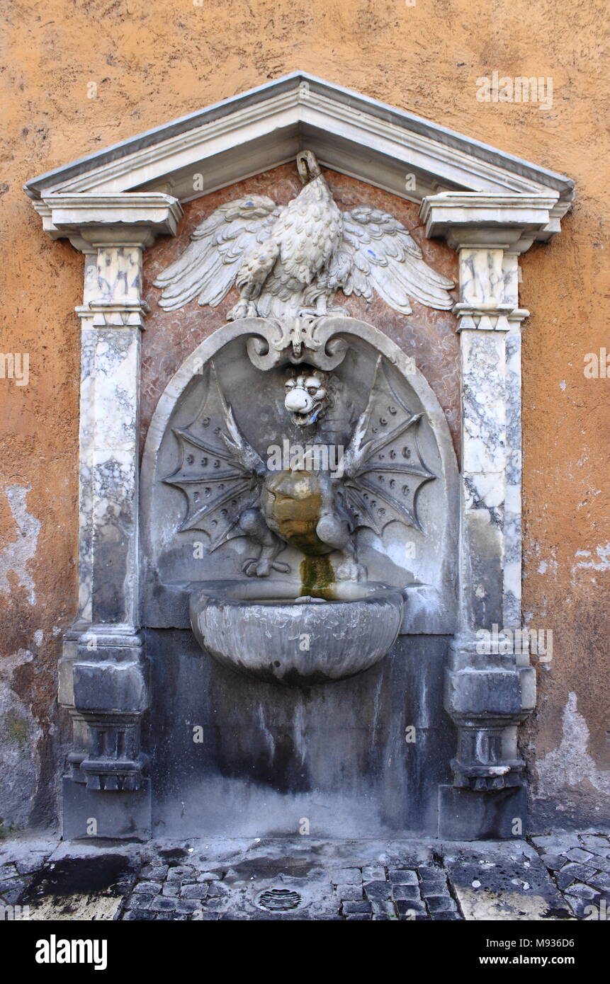 Fountain of the dragon statue in Rome, Italy Stock Photo - Alamy