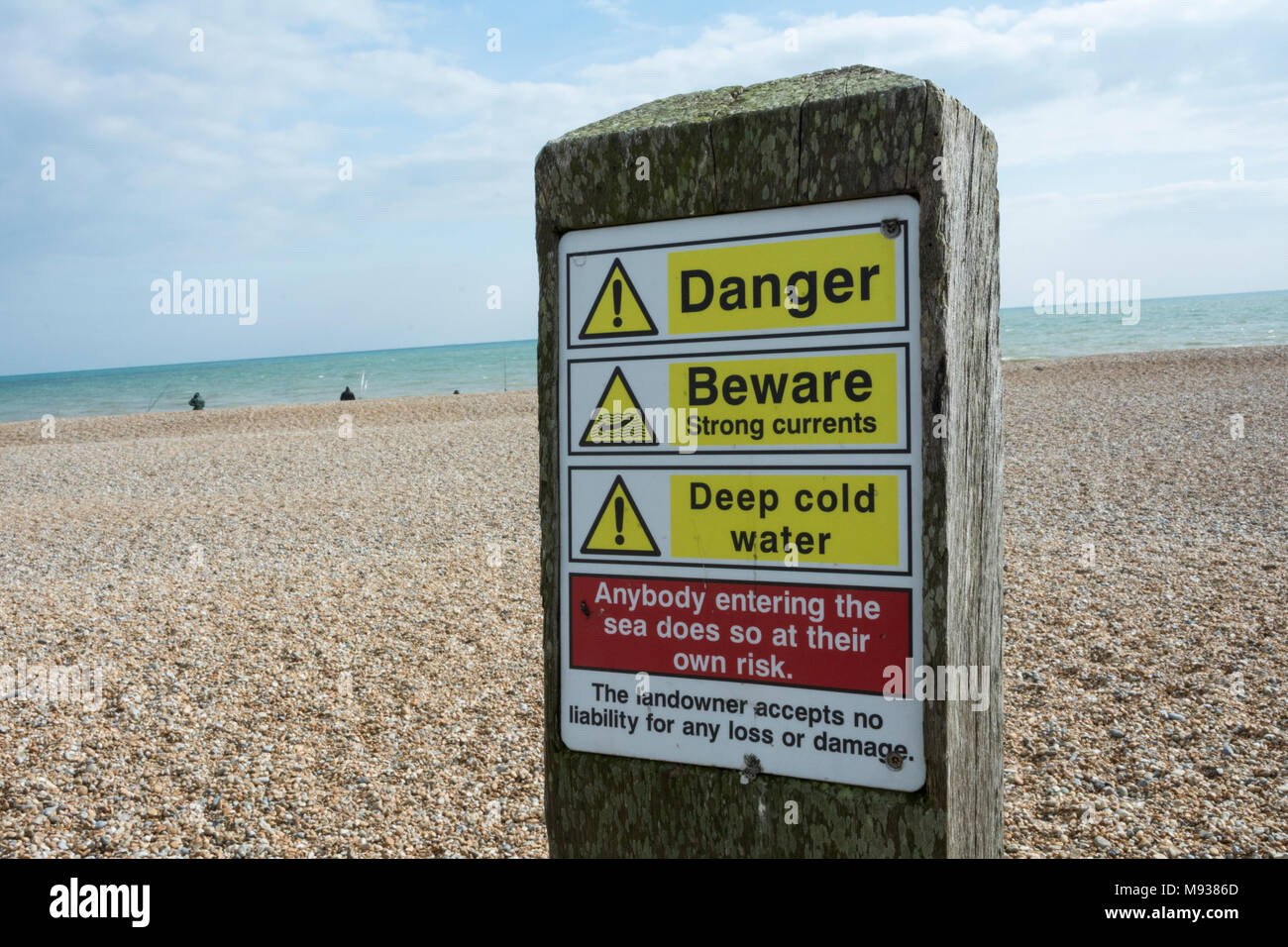 A Danger, Beware Deep Cold Water warning sign on a beach in Kent Stock ...