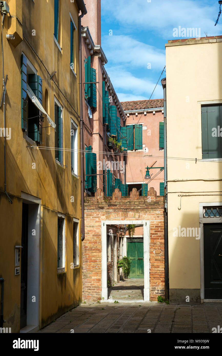 narrow space of ancient scenic backyard in Venice, Italy Stock Photo ...