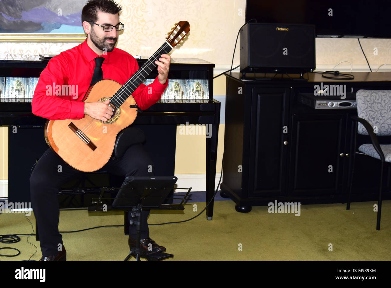 Acoustic guitar player at event Stock Photo - Alamy