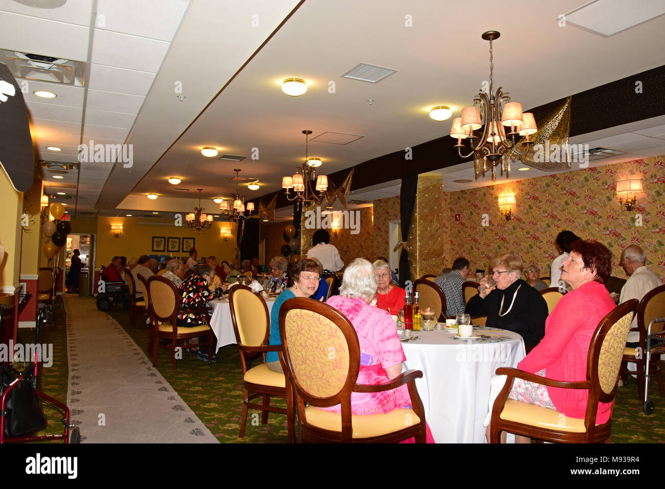 Seniors at living community celebrating Stock Photo - Alamy