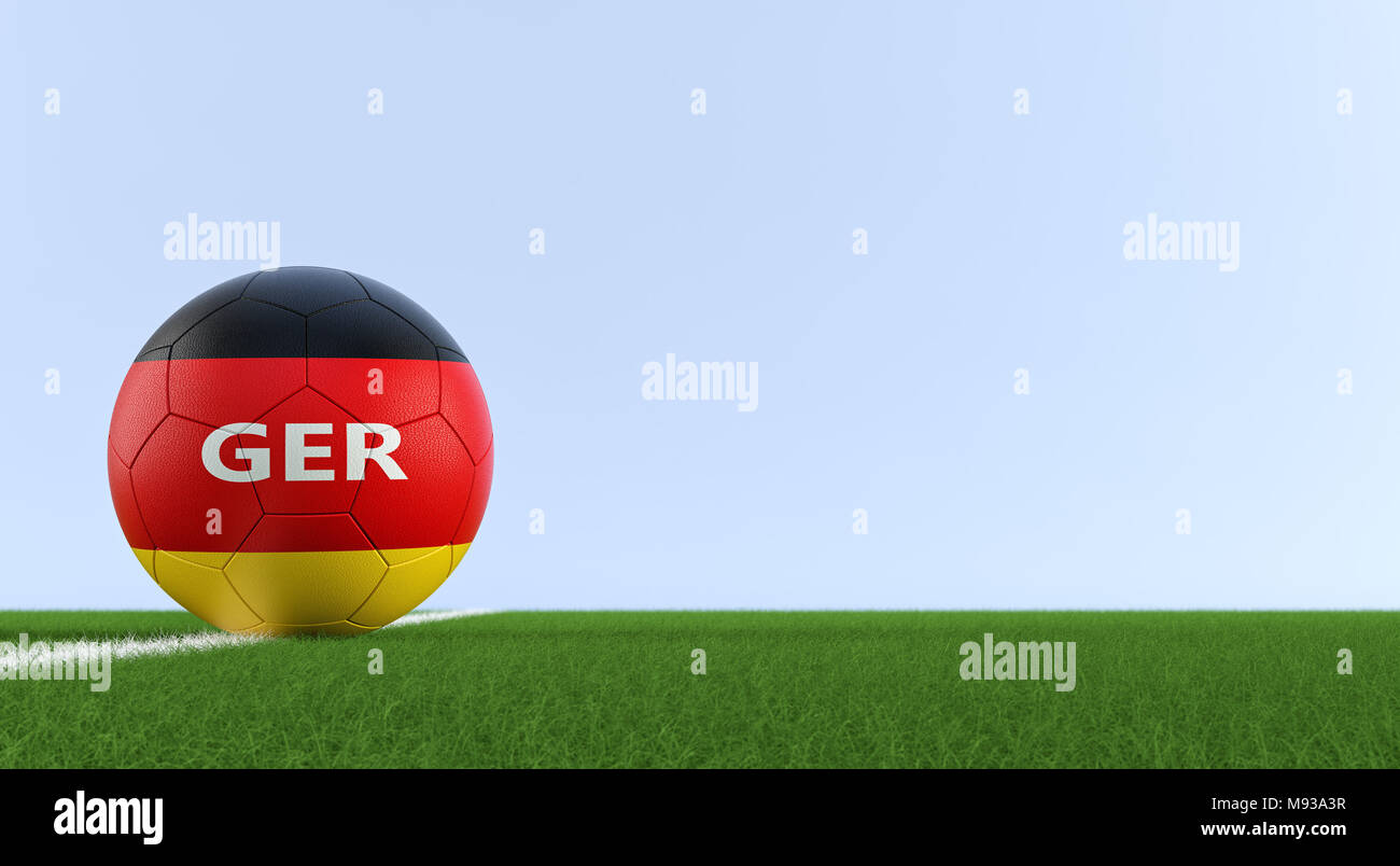 Soccer ball in german national colors on a soccer field. Copy space on ...