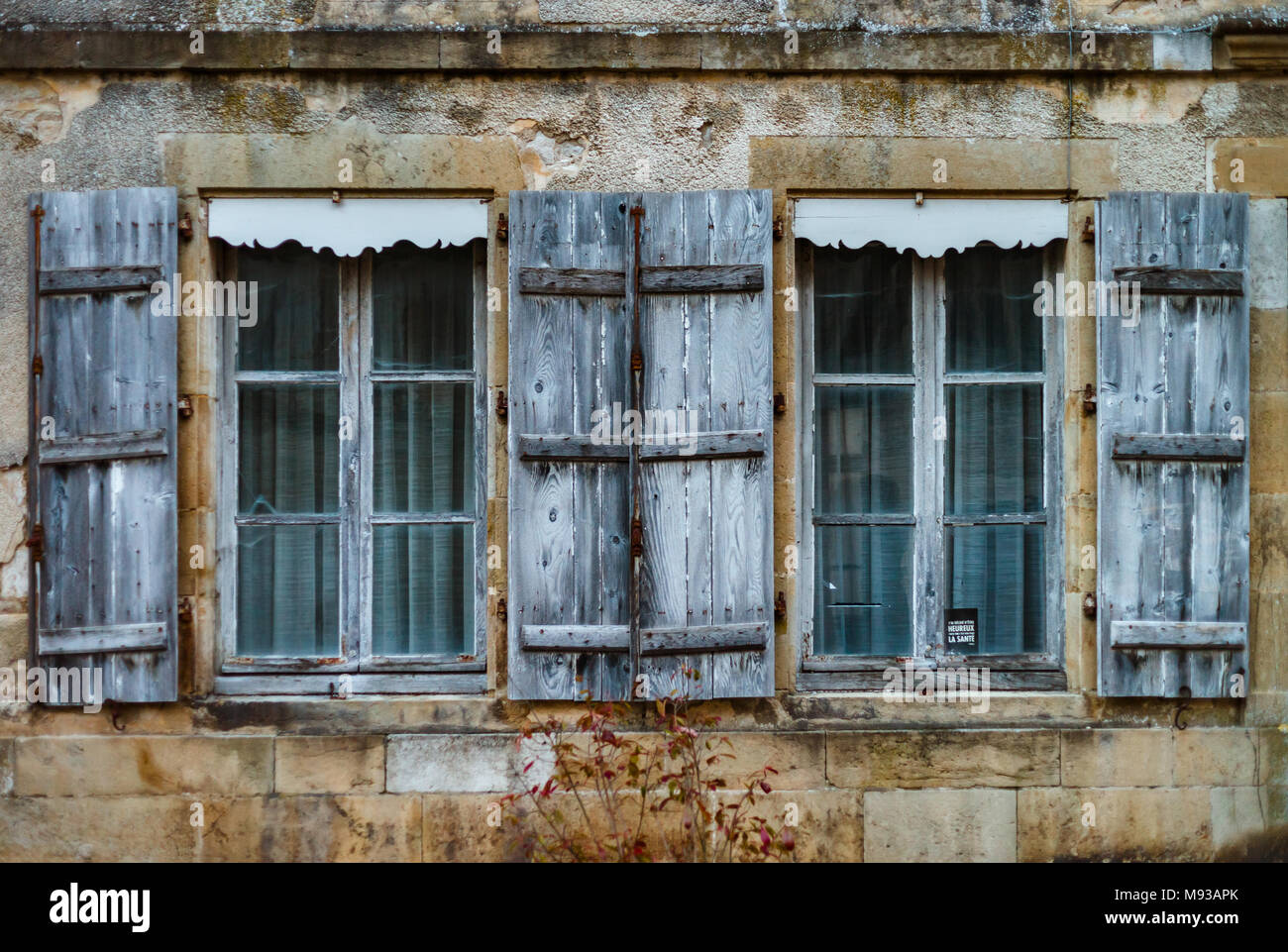 Old wooden windows with shutters in ancient freench city, France Stock ...