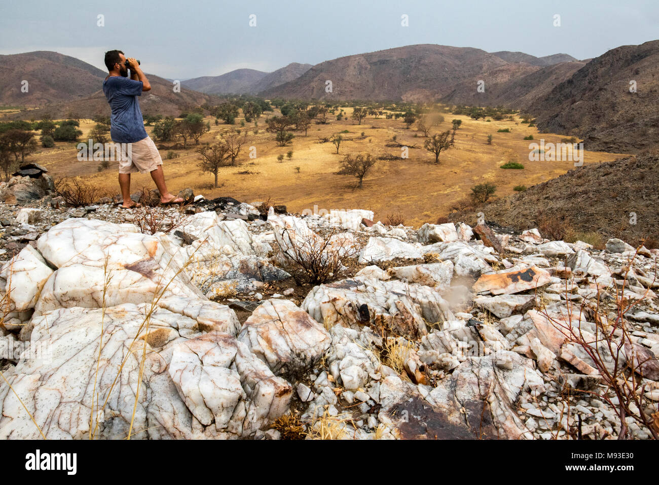 Man looking out at Huab River - Huab Under Canvas, Damaraland, Namibia ...