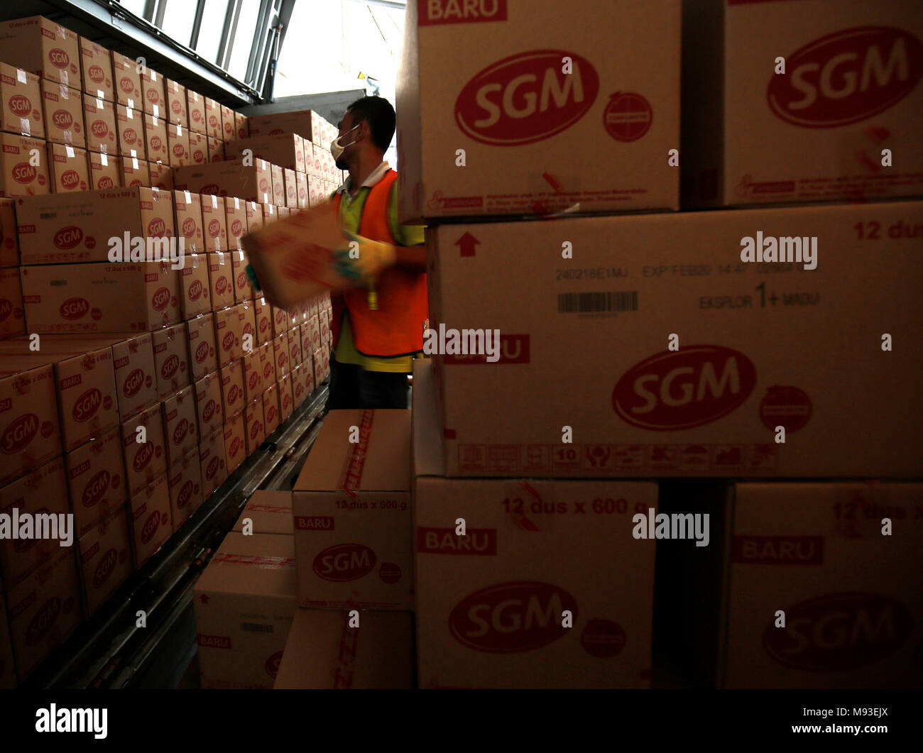 Klaten, Indonesia. 20th Mar, 2018. A worker loading boxes of milk to ...