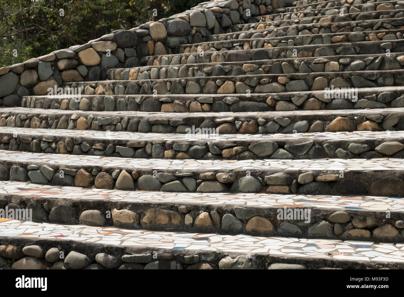 tiled outdoor stairs made with pebble stones - stone steps Stock Photo ...