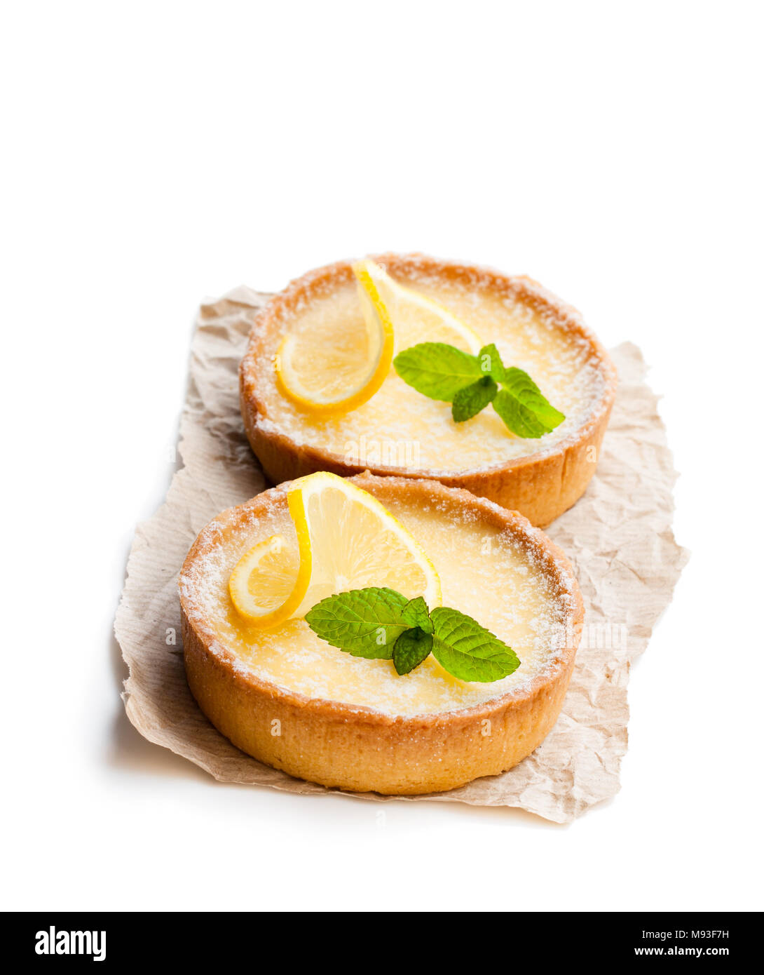 Mini lemon tarts isolated on white Stock Photo - Alamy