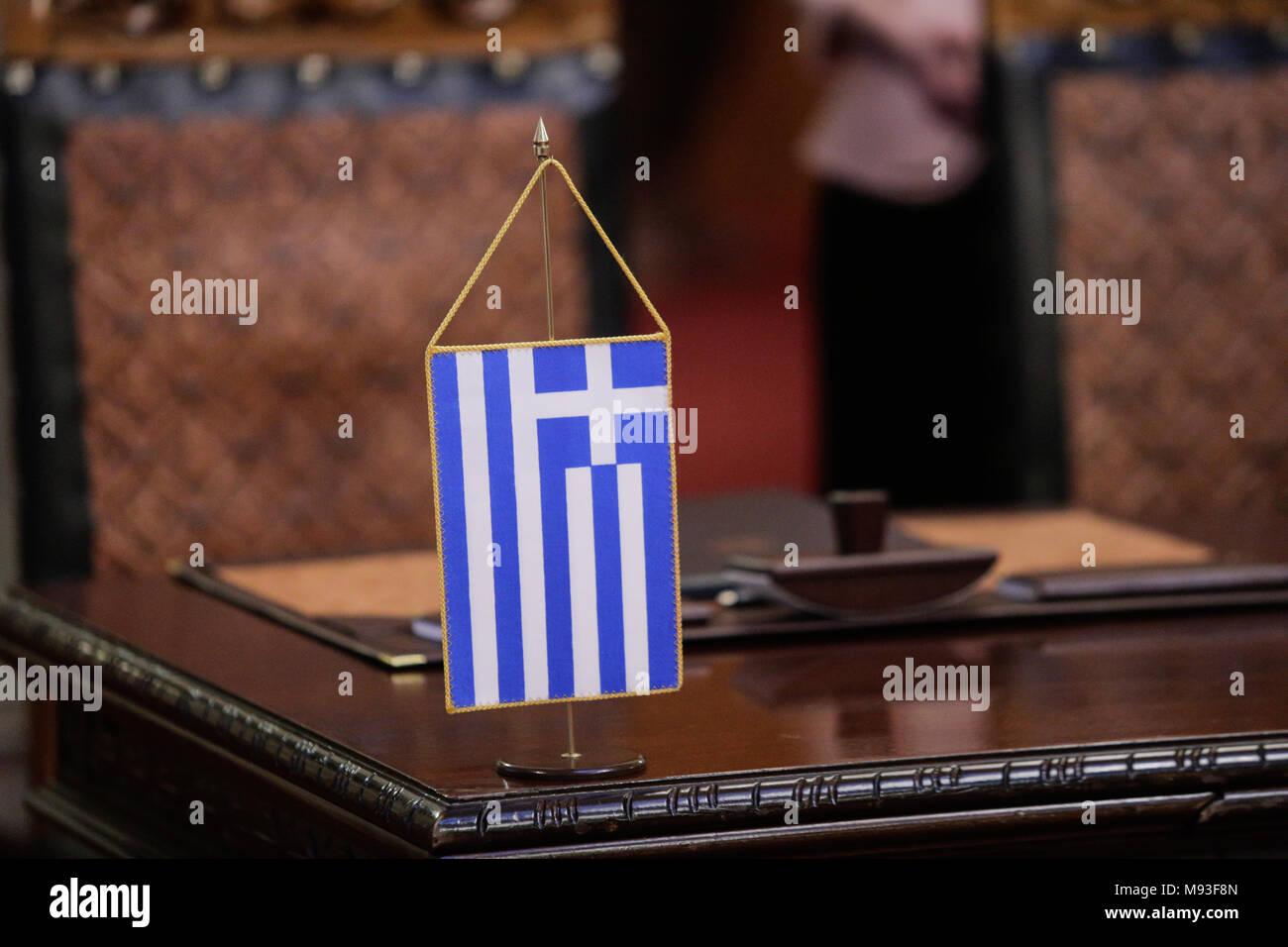 Flag of Greece on wooden table before the official signing of an army ...