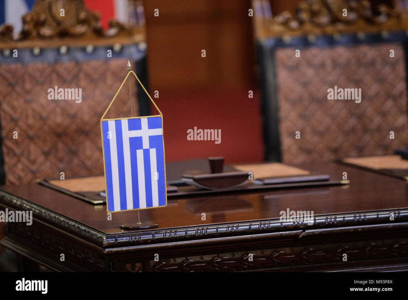 Flag of Greece on wooden table before the official signing of an army ...