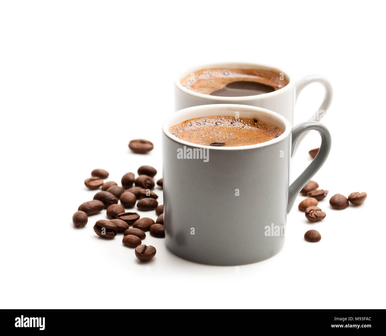 Two coffee cups isolated on white Stock Photo - Alamy