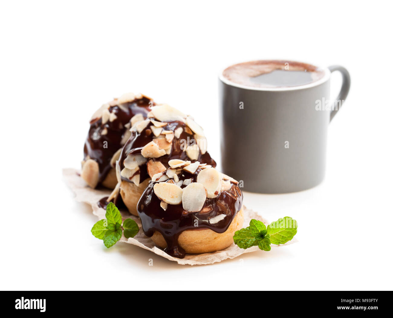 Homemade profiteroles with cup of coffee isolated on white Stock Photo ...