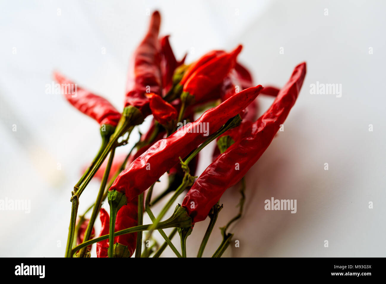 Red hot peppers dried on display in natural light Stock Photo - Alamy
