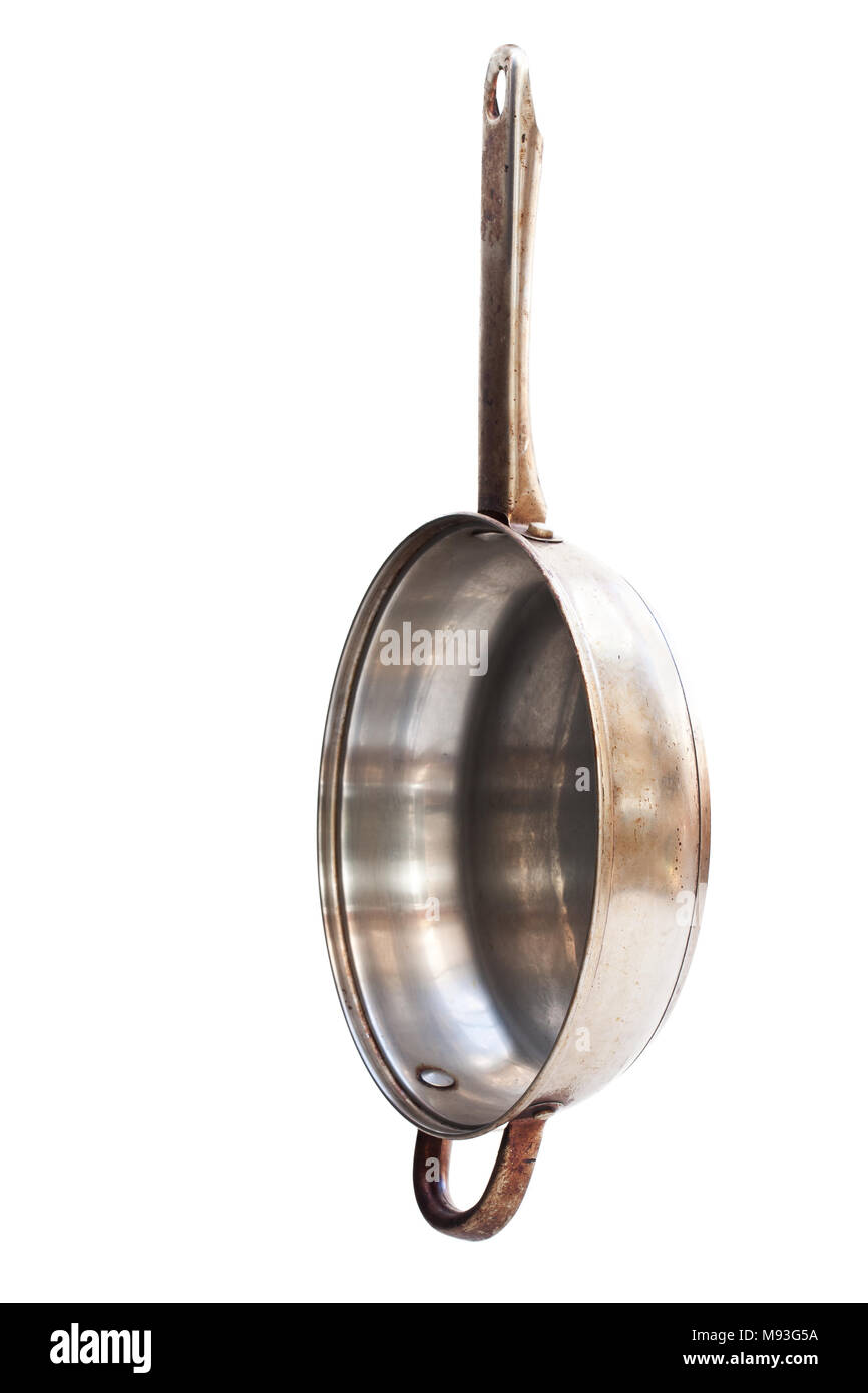 Hanging used frying pan isolated on white Stock Photo - Alamy
