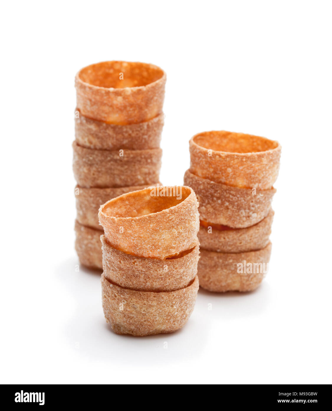 Stacks of croustades crispy pastry cases isolated on white Stock Photo ...