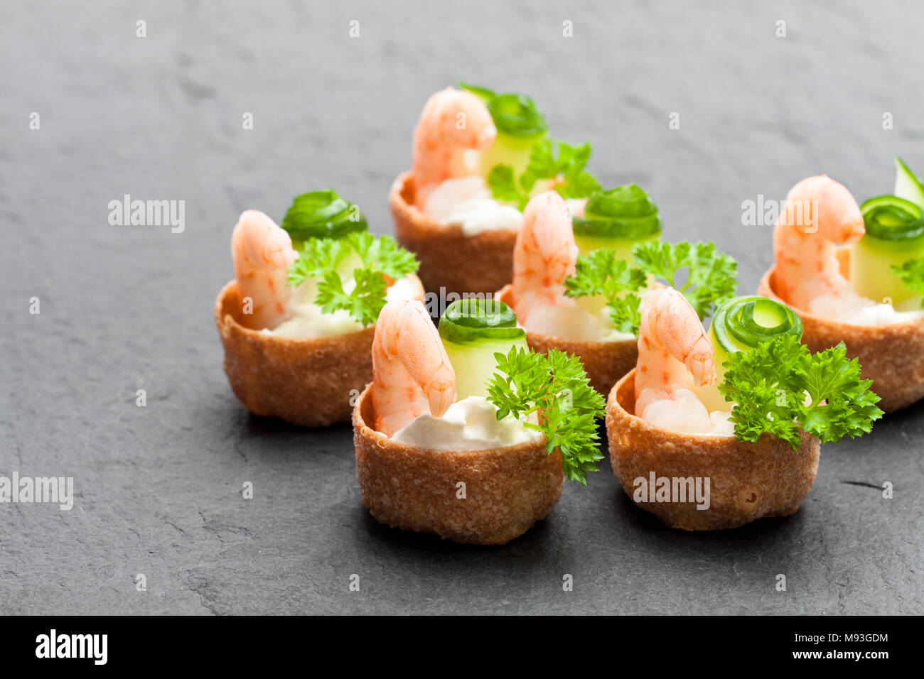 Salted croustades crispy pastry stuffed with cream cheese and prawns on ...