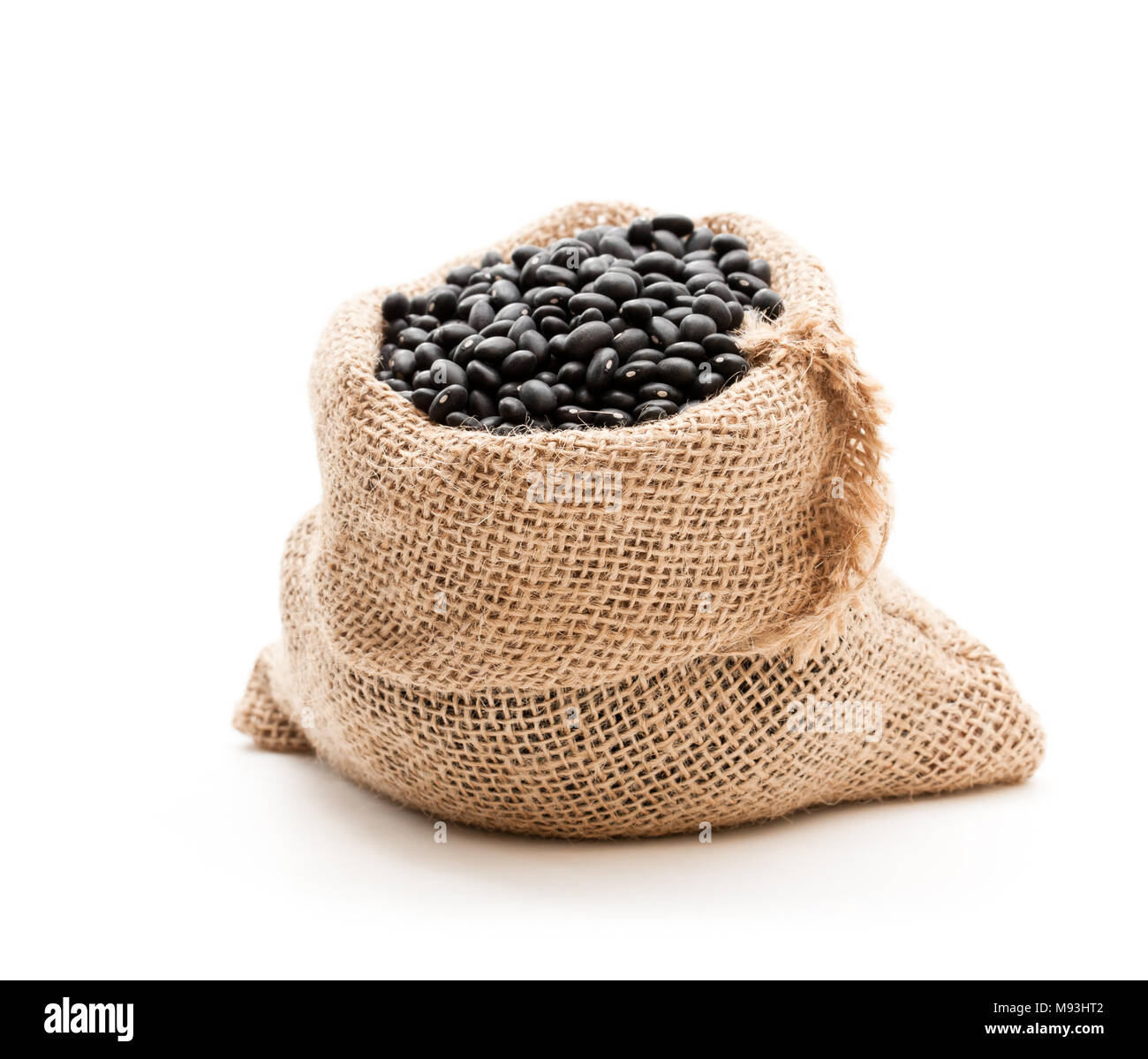 Raw black beans in the sack bag isolated on white Stock Photo - Alamy