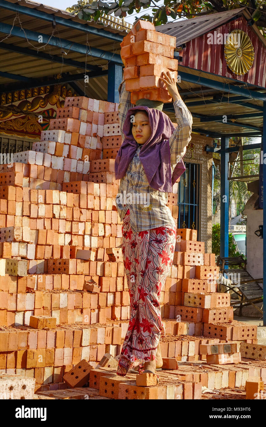 Construction worker carrying bricks hi-res stock photography and images ...