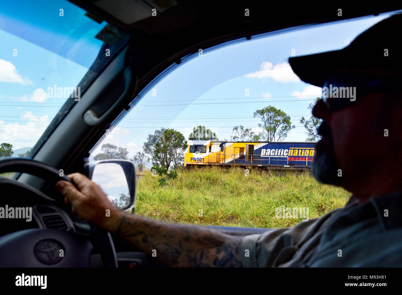 ROAD SIDE VIEW OF COAL TRAIN FROM INSIDE CAR Stock Photo - Alamy
