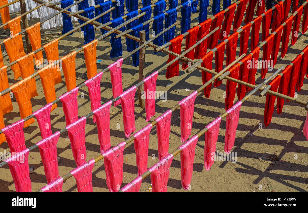 Drying colorful fabric after traditional dye process shot at the ...