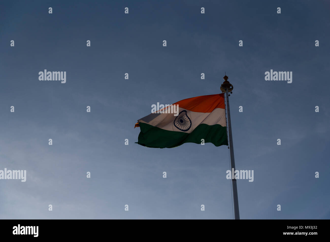Tri color flag under beneath clear blue sky and light clouds hi-res ...