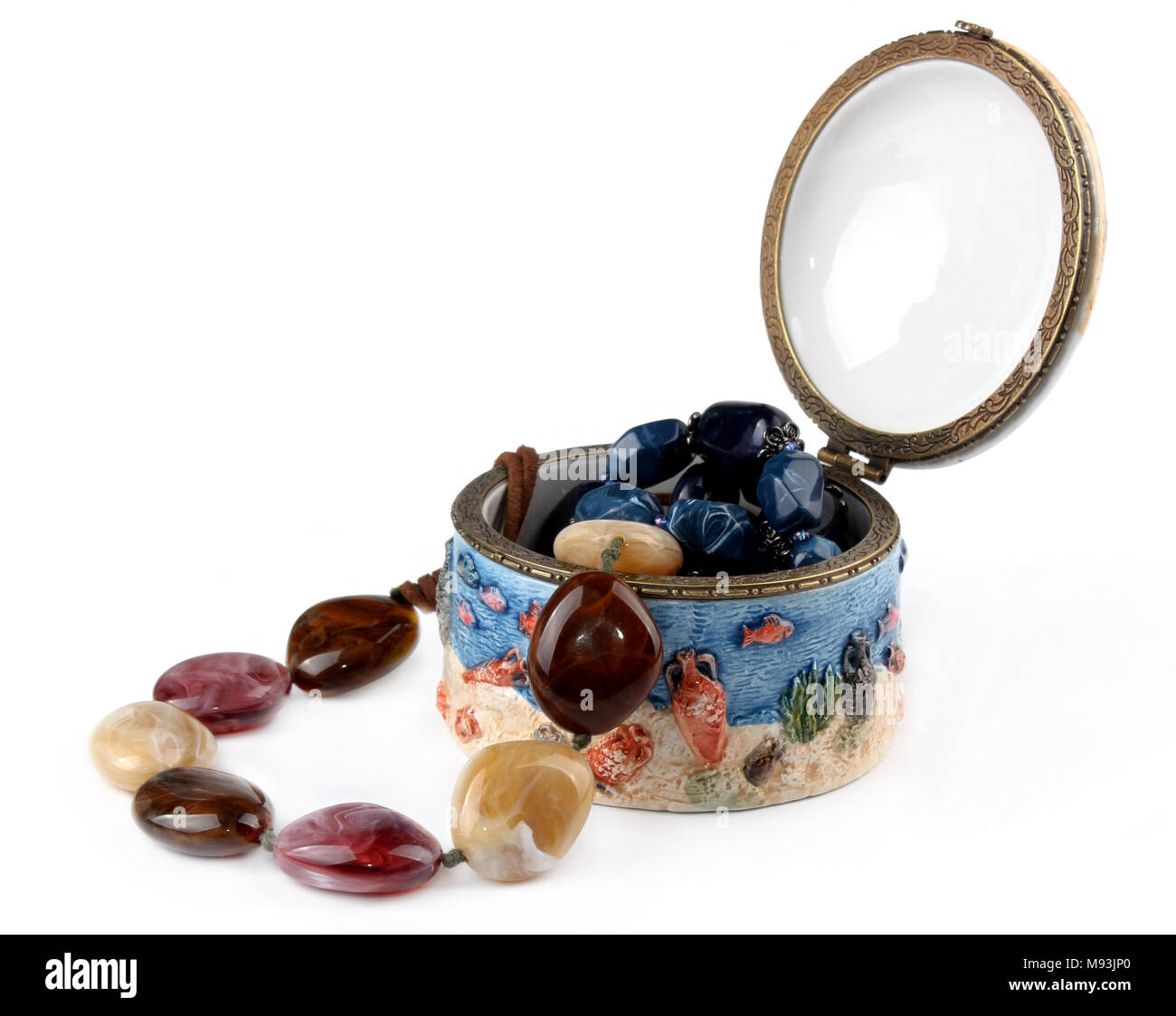 Beads of colored stones in a box on a white background Stock Photo - Alamy