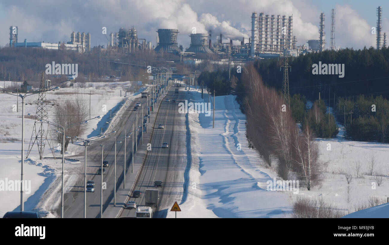 Industrial landscape, winter factory road and smoking pipes Stock Photo ...