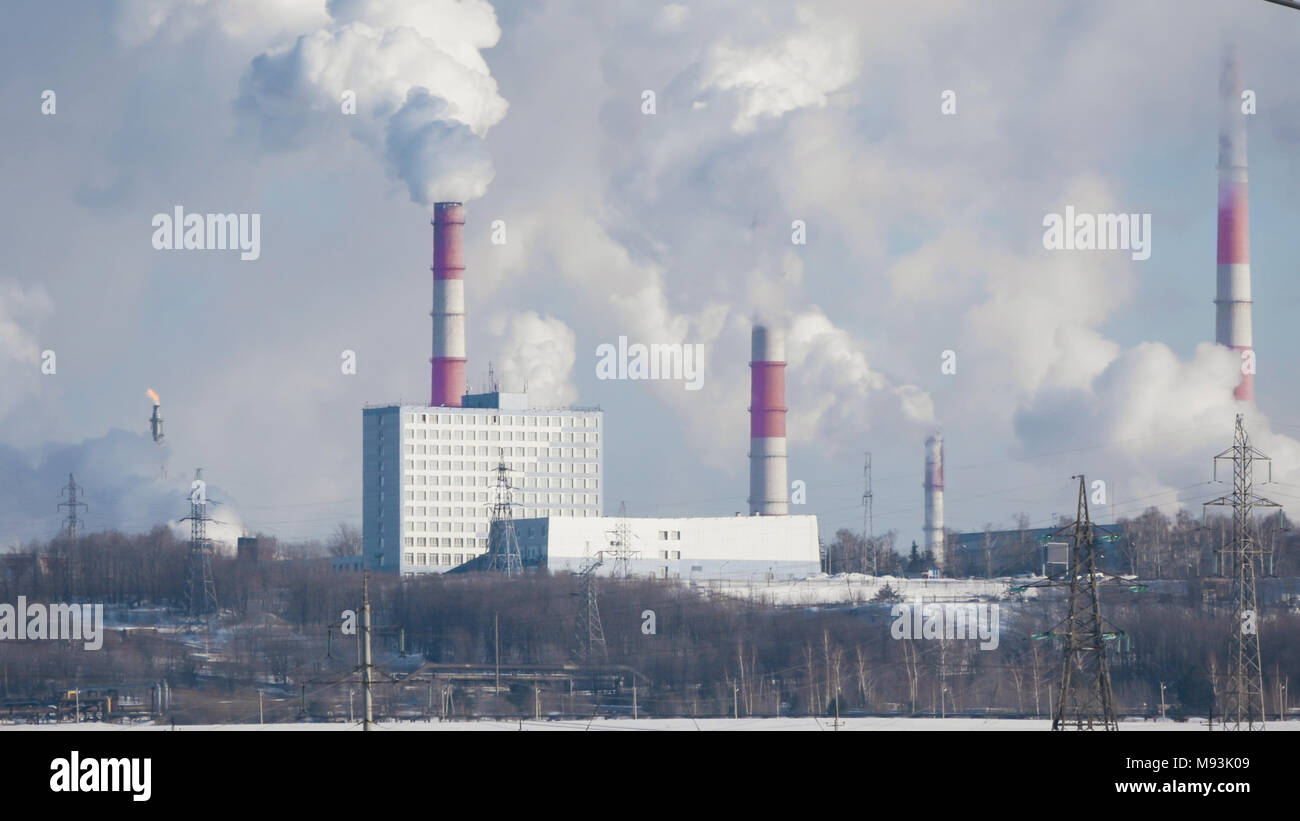Industrial landscape, plant with smoking pipes and gas torches Stock ...