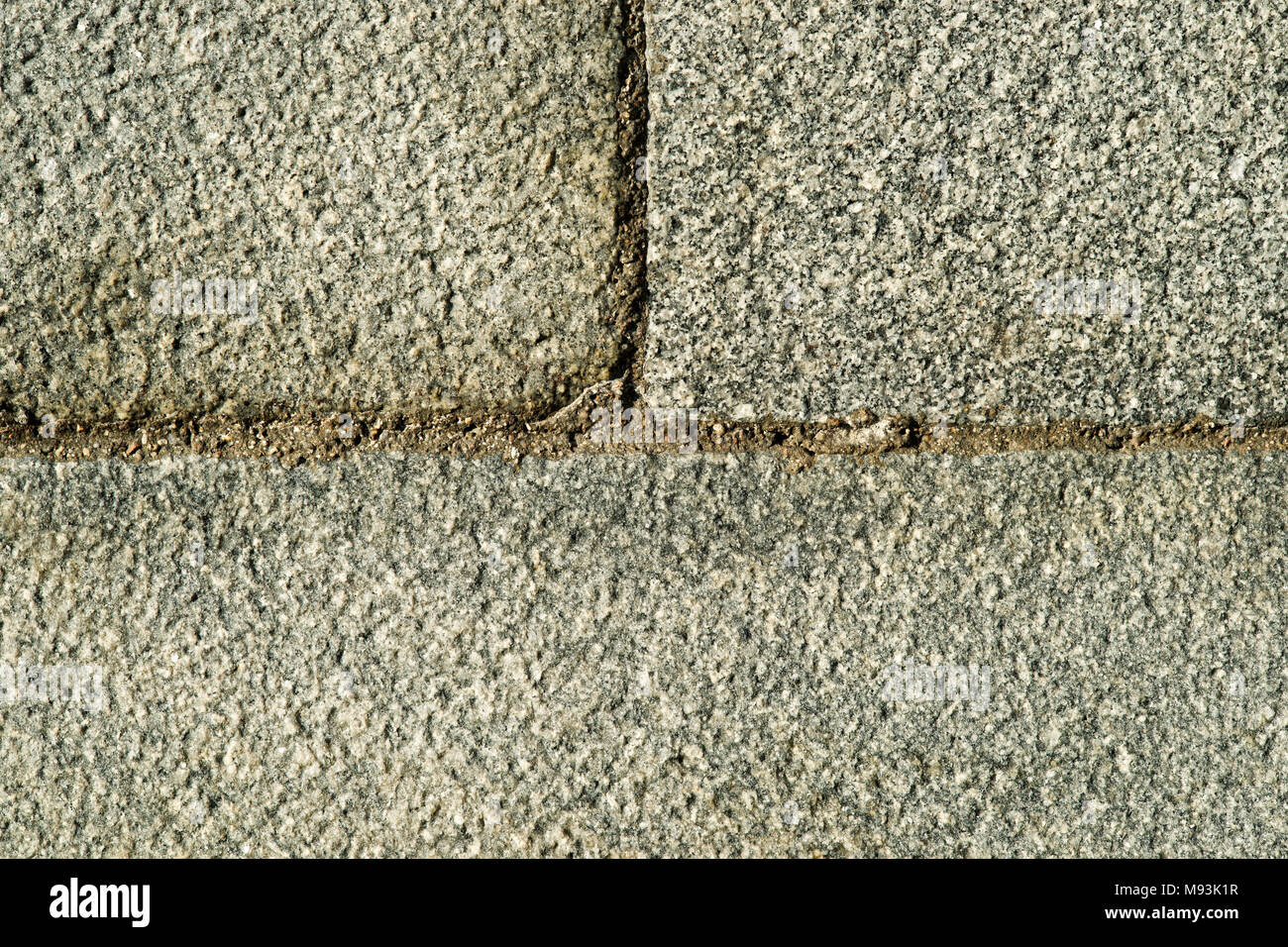 Texture of stone wall made of three granite rock blocks Stock Photo - Alamy