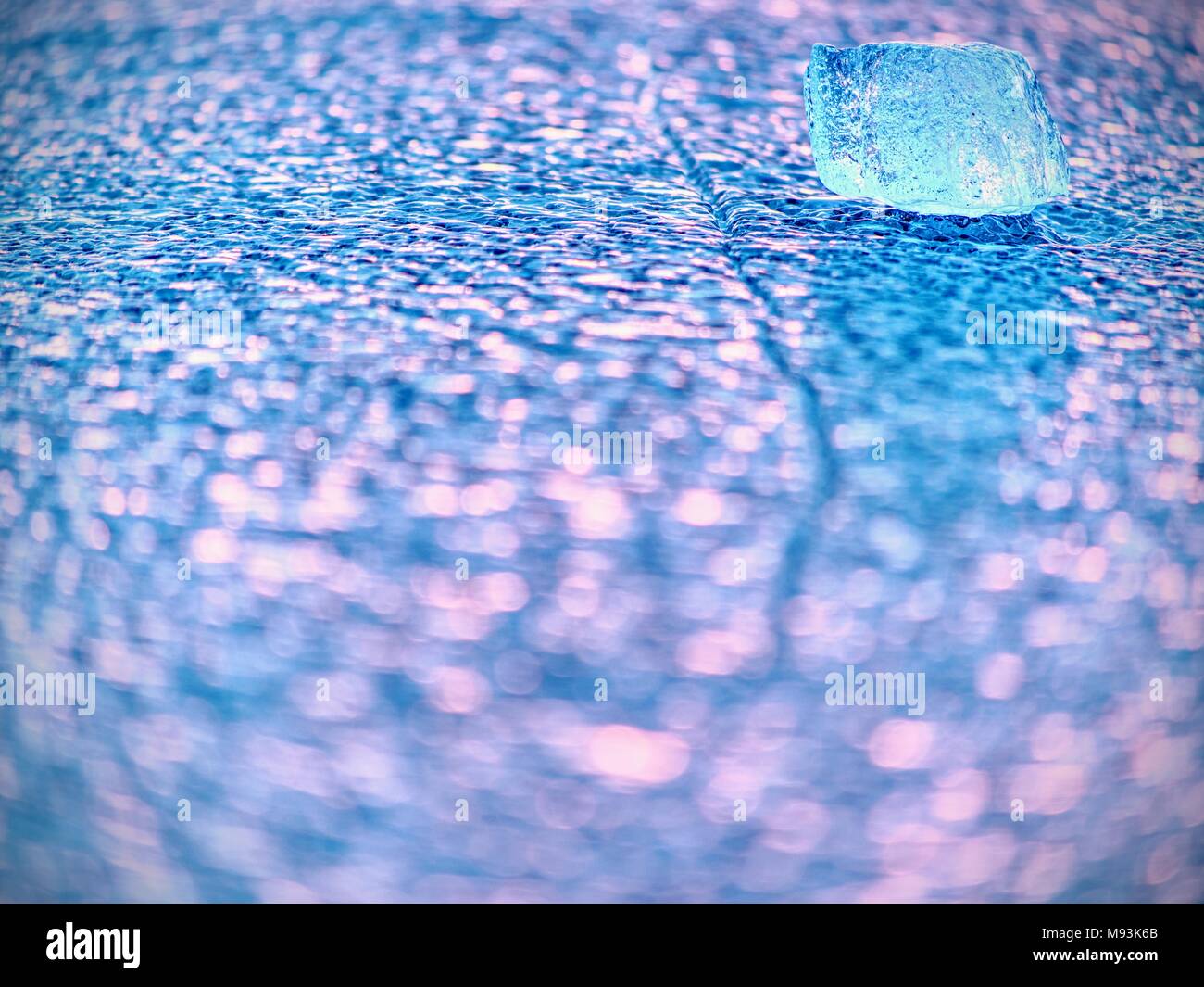 Shining icebergs and ice floes, ice clefts reflected rays in the smooth ...