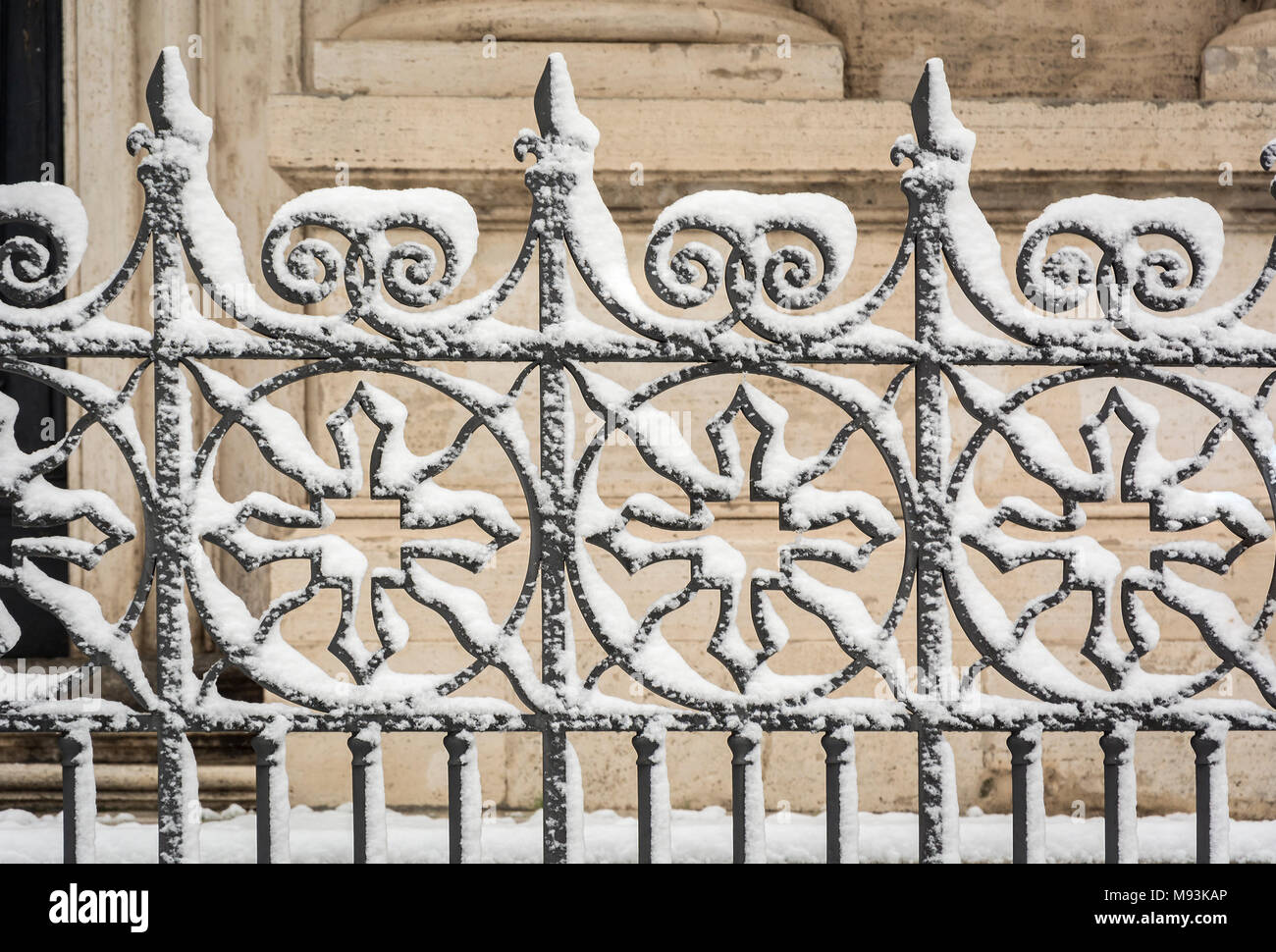 iron decorated gate covered with snow. Seasonal concept Stock Photo - Alamy