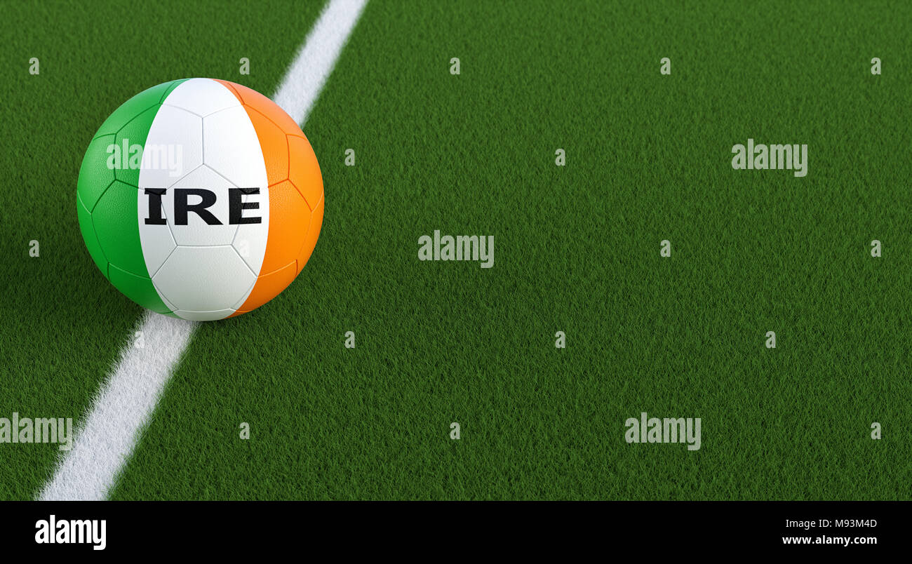 Soccer ball in irish national colors on a soccer field. Copy space on ...